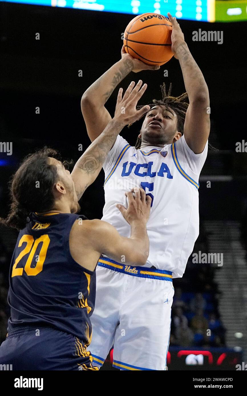 UCLA guard Brandon Williams, top, shoots as California guard Jaylon ...