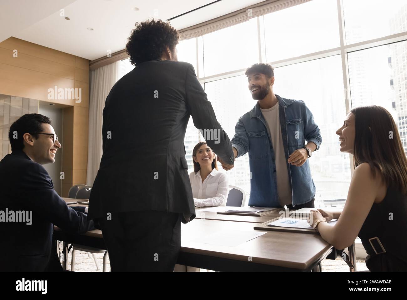 Cheerful young Arab startup leader and investor getting agreement Stock ...