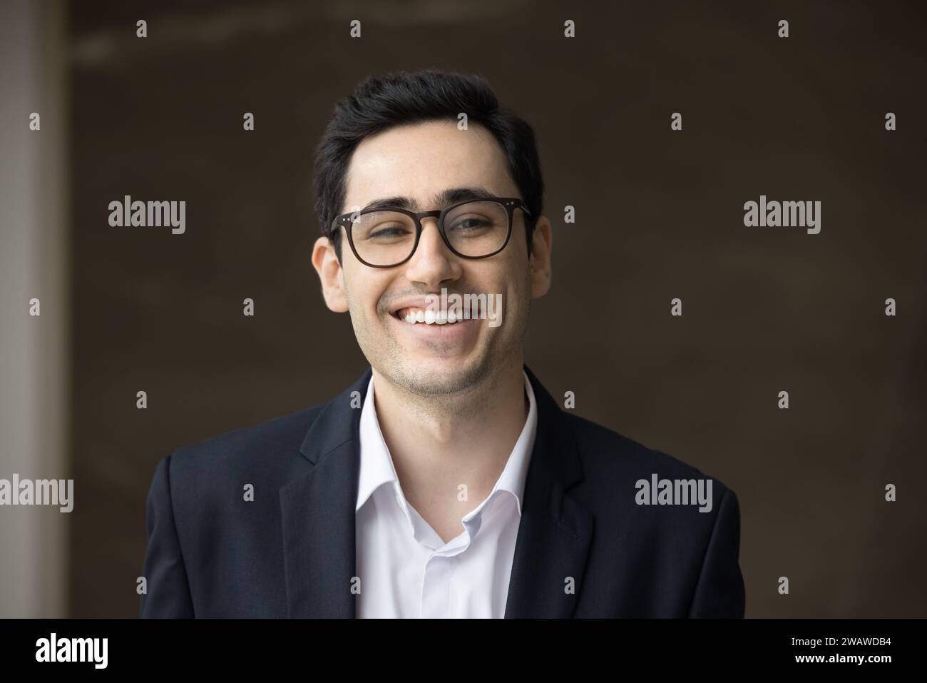 Happy Arab business man in formal jacket looking at camera Stock Photo ...