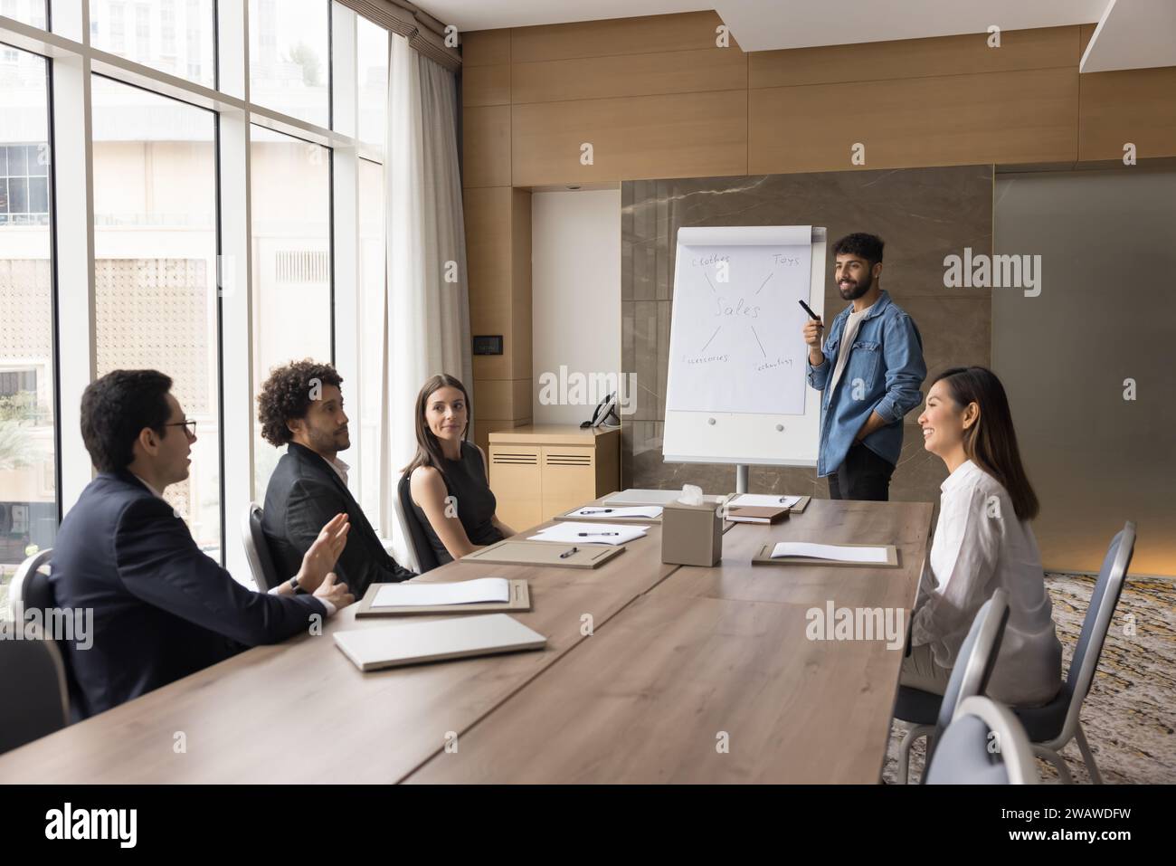 Positive young Arab startup leader guy speaking at whiteboard Stock ...