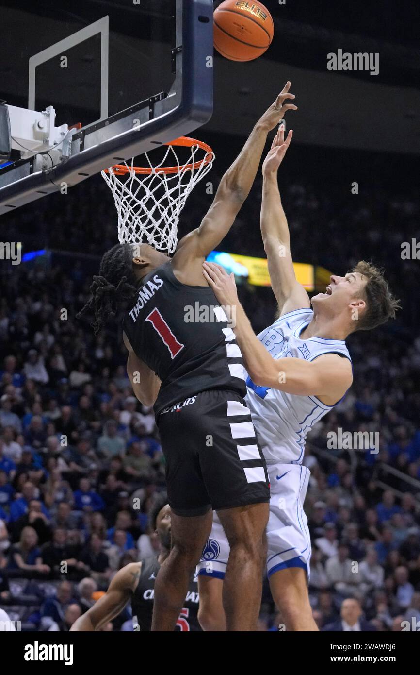 Cincinnati guard Day Day Thomas (1) defends against BYU guard Trevin ...