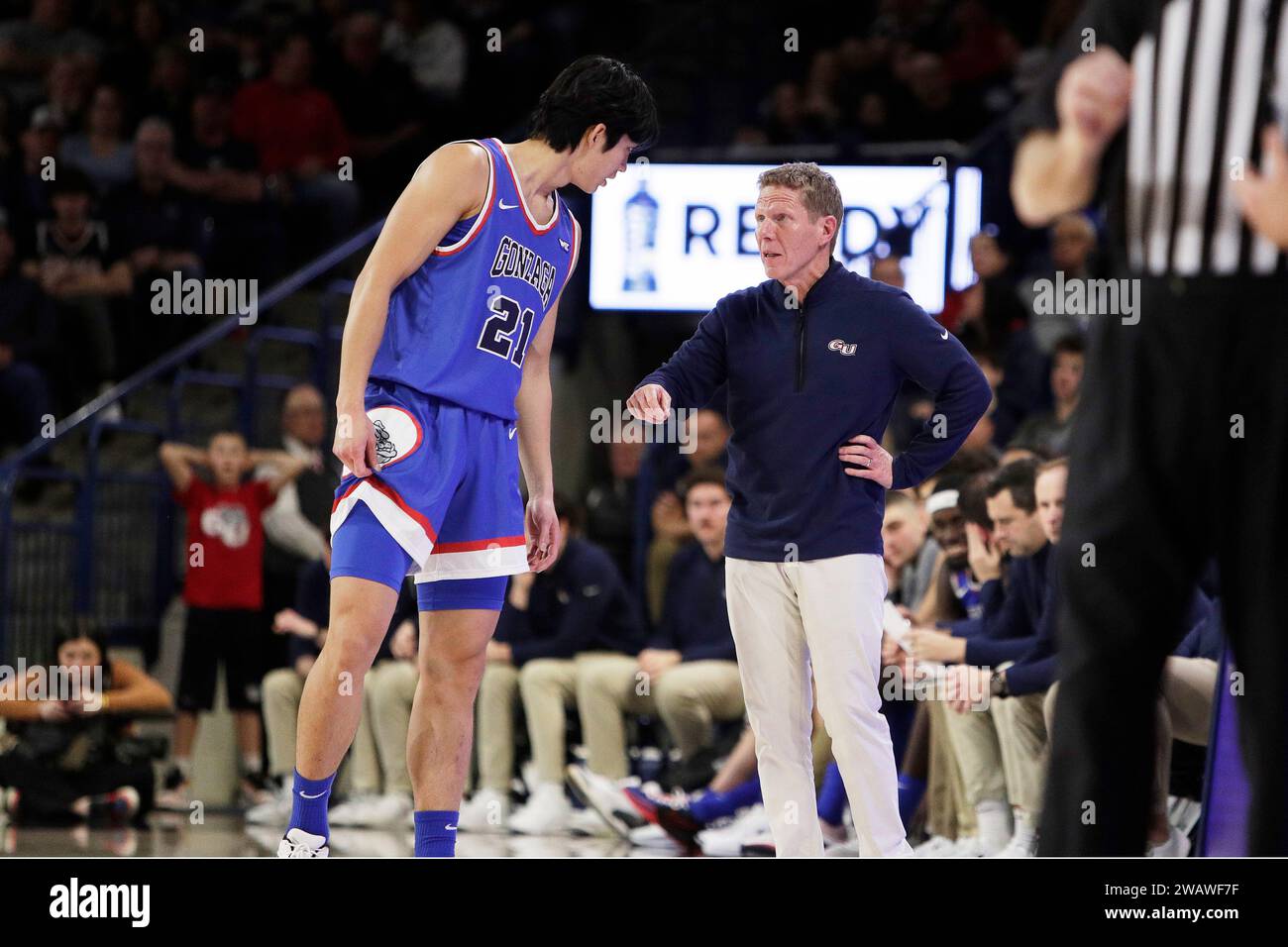 Gonzaga head coach Mark Few, right, speaks with forward Jun Seok Yeo ...