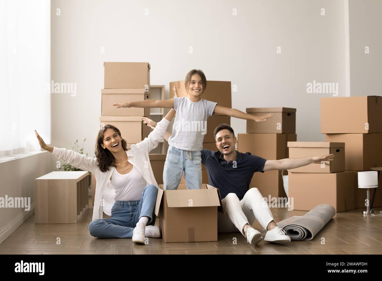 Happy little kid girl dancing in cardboard box Stock Photo - Alamy