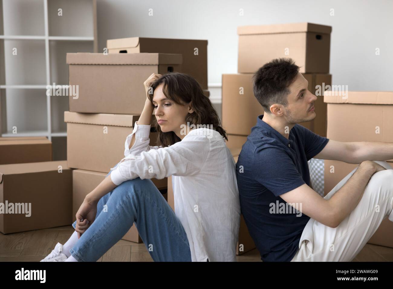 Sad tired married couple moving out from common flat Stock Photo - Alamy