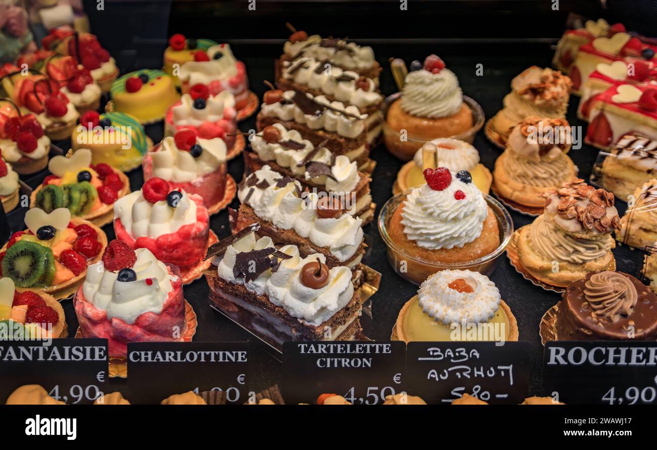 Delicate petit four desserts on display at an artisanal French bakery ...