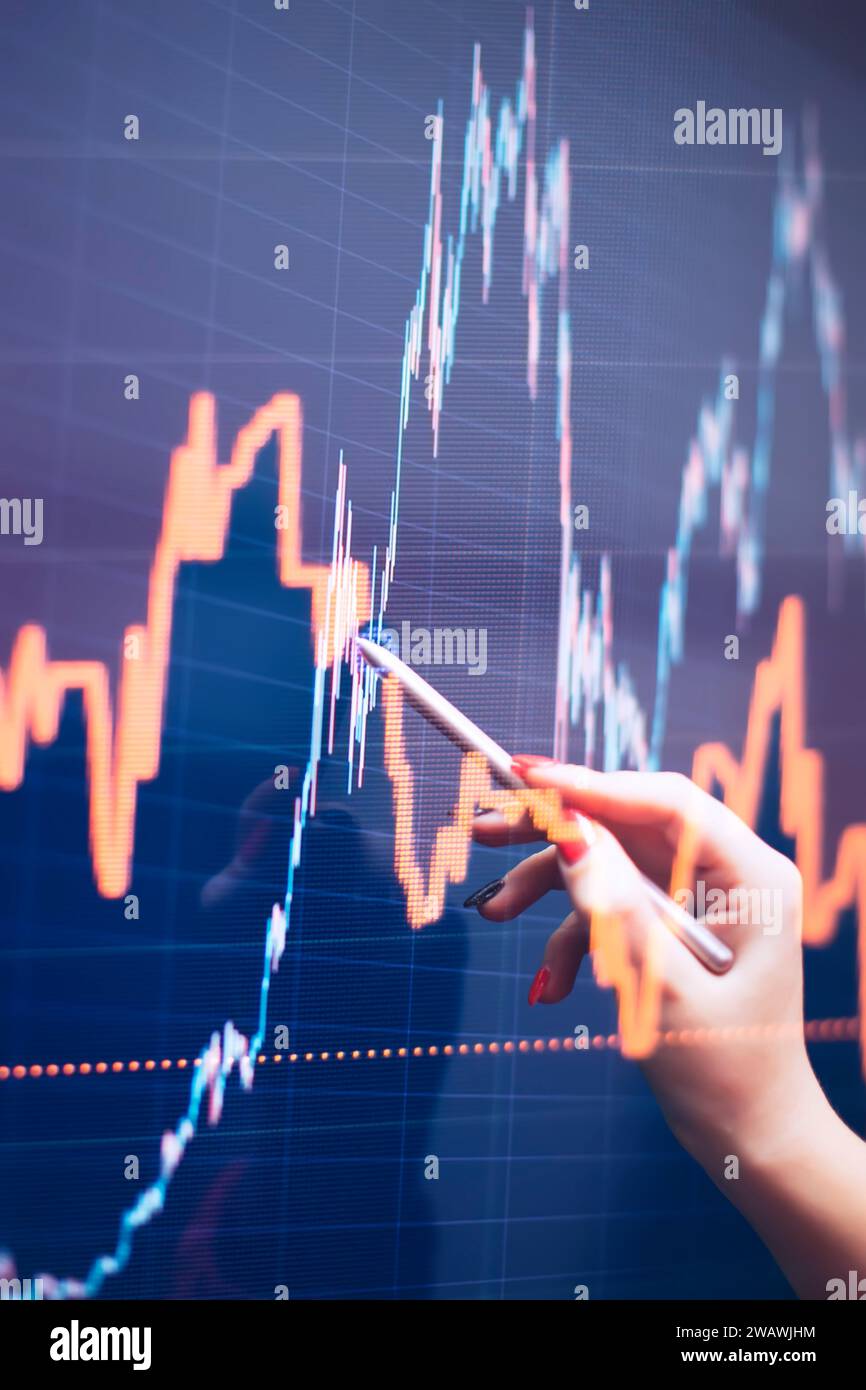 Businesswoman manually drawing a diagram on a touch screen interface ...