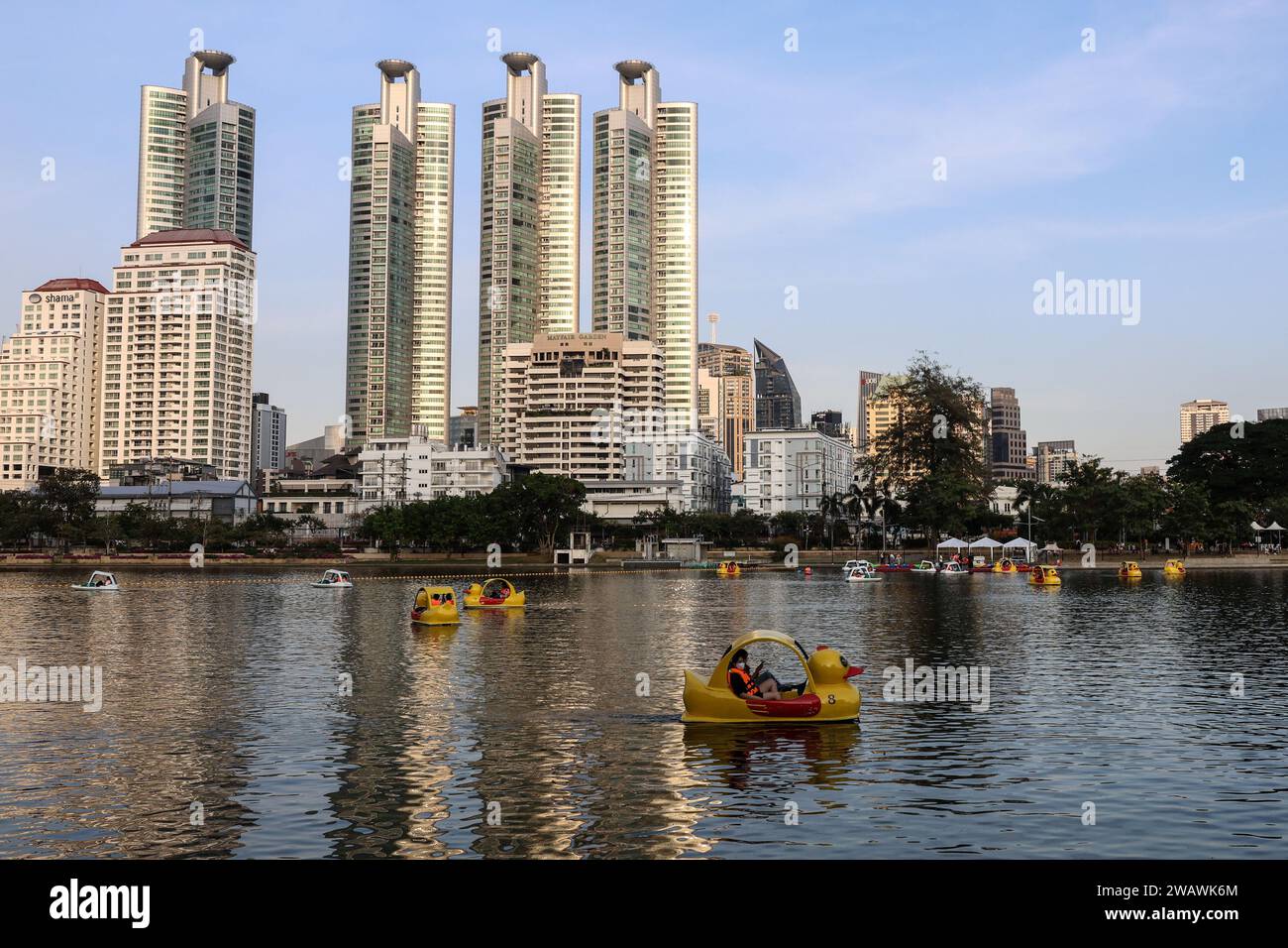 Bangkok, Thailand. 6th Jan, 2024. People sail a lake on duck-shaped ...