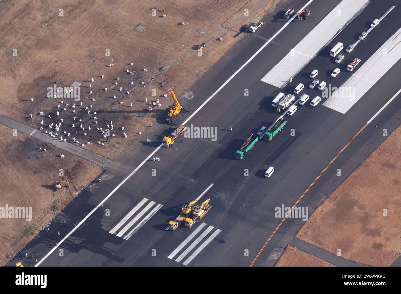 A Japan Airlines Flight 516, which was burnt remains on the C runway ...