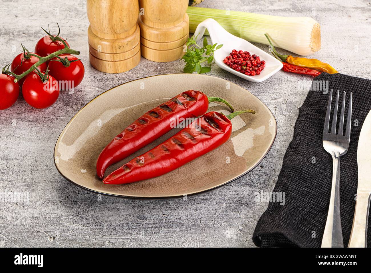 Grilled red spicy pepper snack in the bowl Stock Photo - Alamy