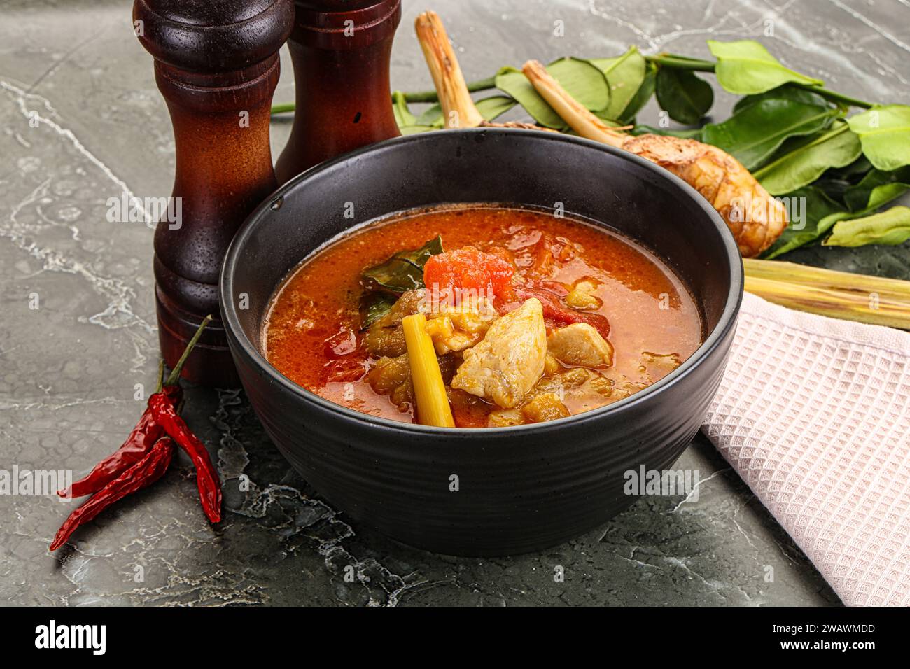 Thai traditional Tom Yum spicy soup with chicken Stock Photo - Alamy