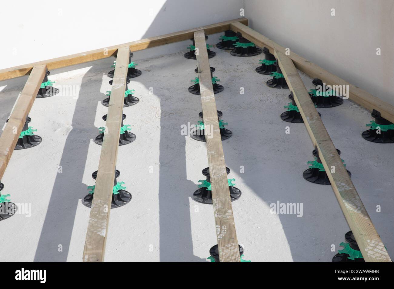 Constructing terrace wooden area on plastic piles adjustable level stud ...