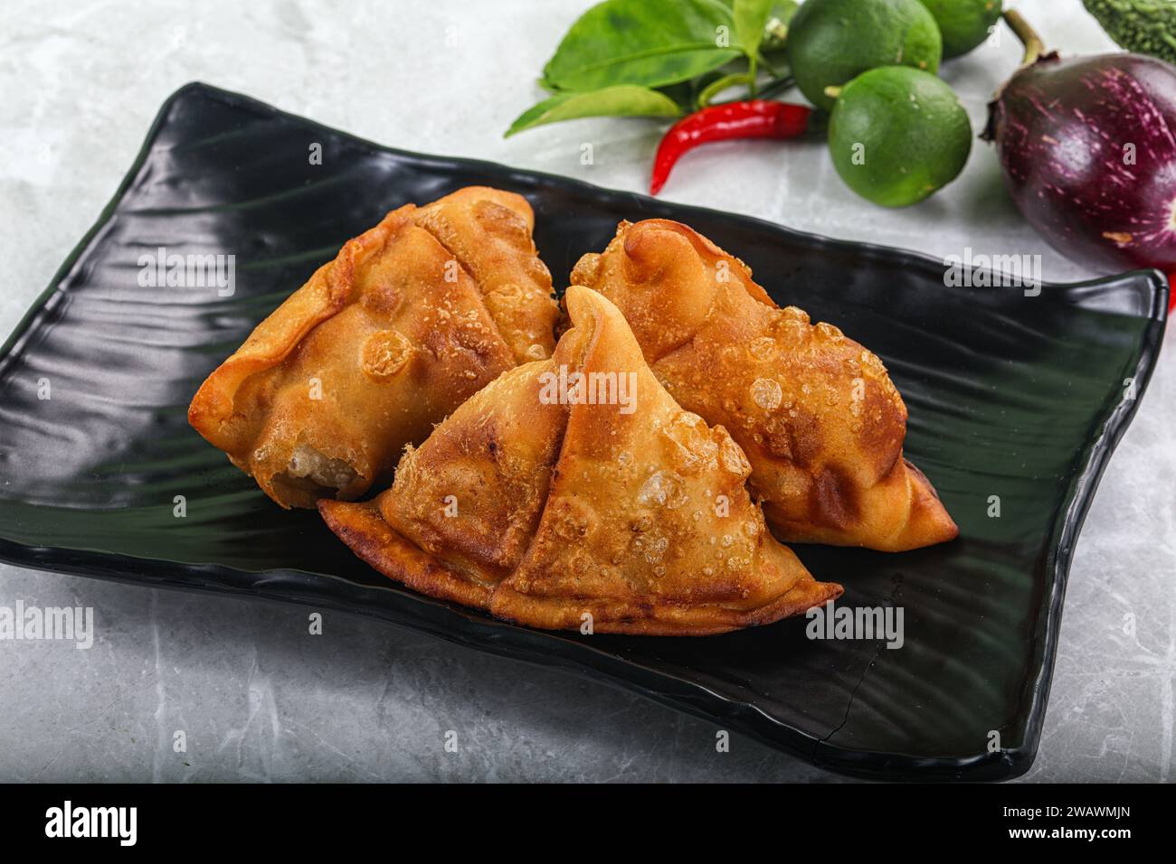 Indian cuisine - fries crispy stuffed samosa Stock Photo - Alamy