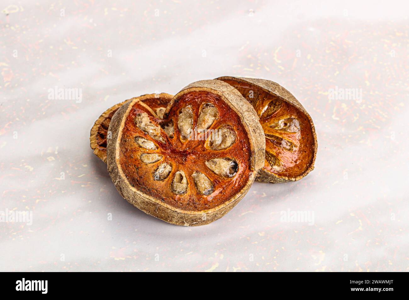 Thai cuisine - dry bael fruit for drinks Stock Photo - Alamy