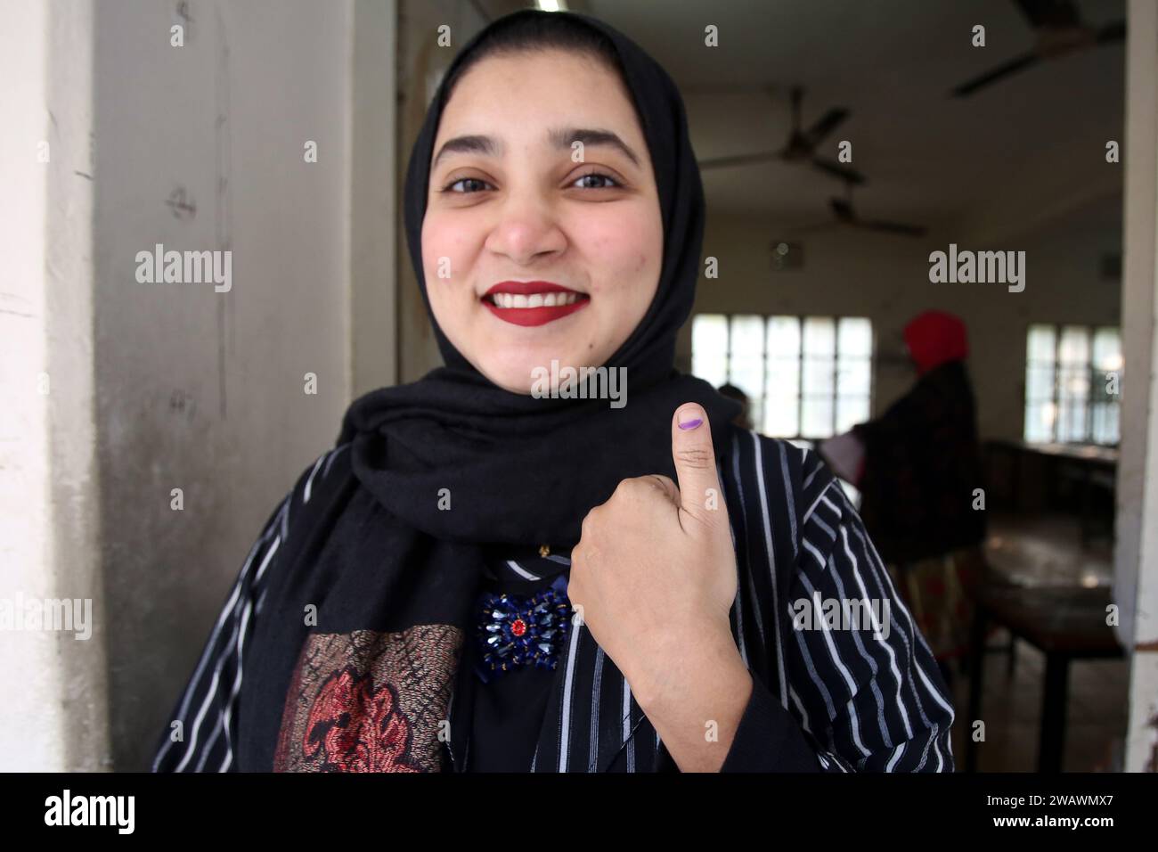 Dhaka, Wari, Bangladesh. 7th Jan, 2024. A Man & woman shows her inked thumb after voting at a ...