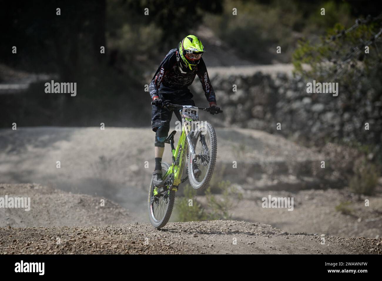 Cyclist jumping on a MTB downhill mountain bike Stock Photo - Alamy