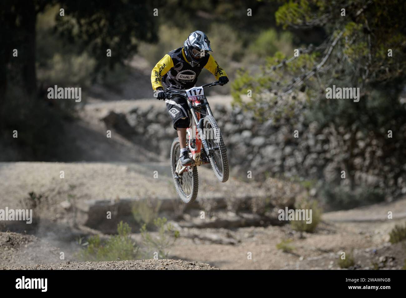 Cyclist jumping on a MTB downhill mountain bike Stock Photo - Alamy