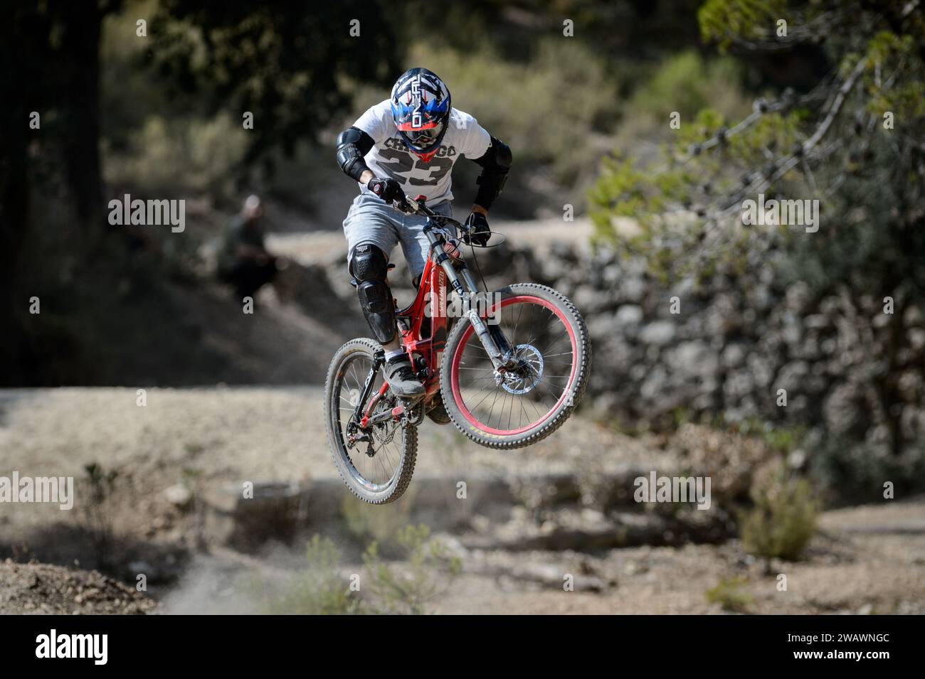 Cyclist jumping on a MTB downhill mountain bike Stock Photo - Alamy