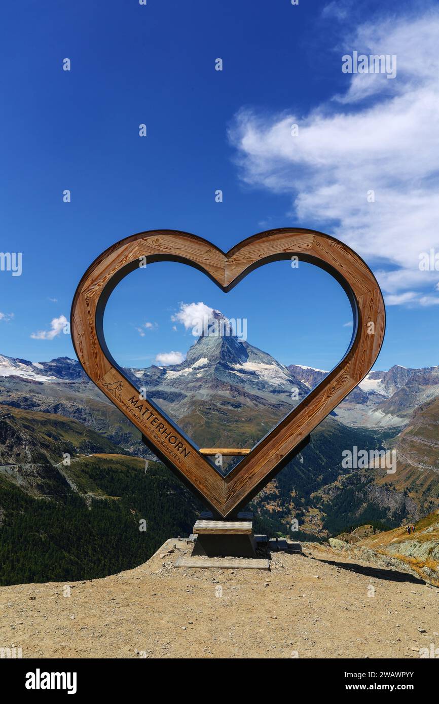 Zermatt, Switzerland - 02 August 2022: Photo frame in Wooden Heart with ...
