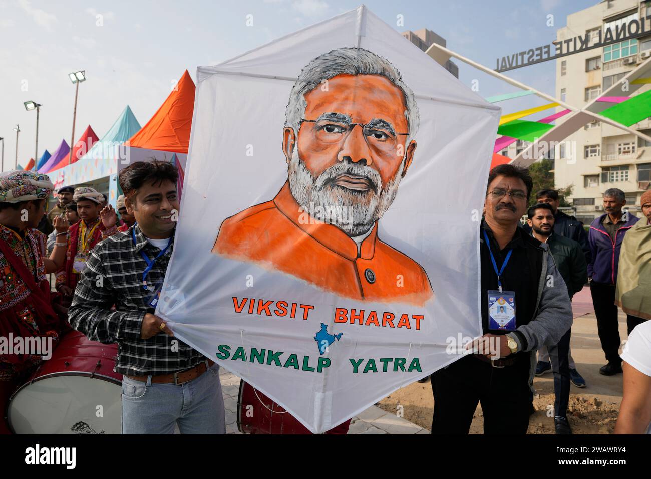 Participants display a kite with an image of Indian Prime Minister ...