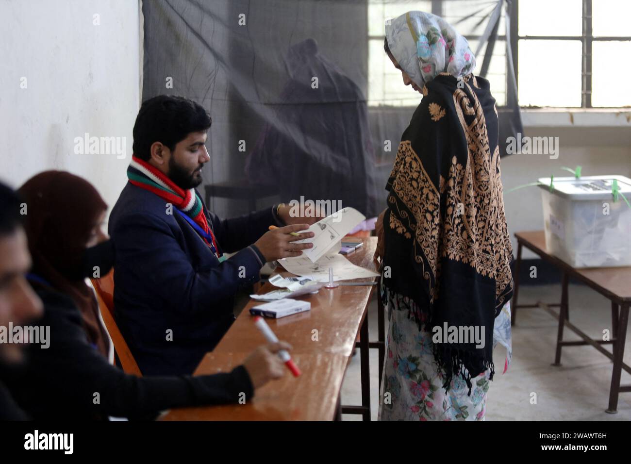 Dhaka, Bangladesh. 07th Jan, 2024. People check their names in the ...