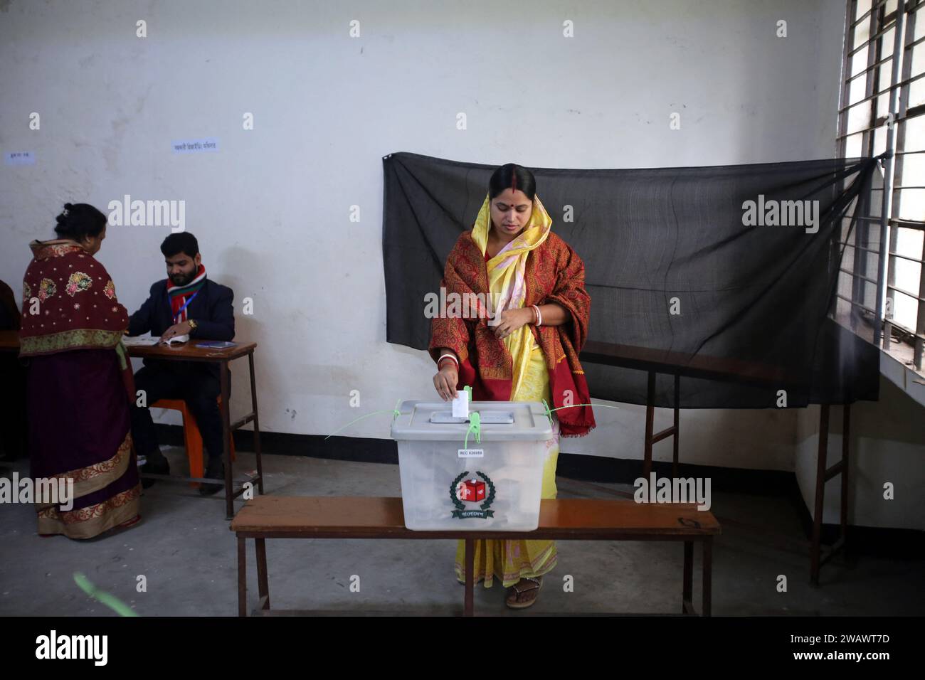 People casts her vote at a polling center during the 12th national ...