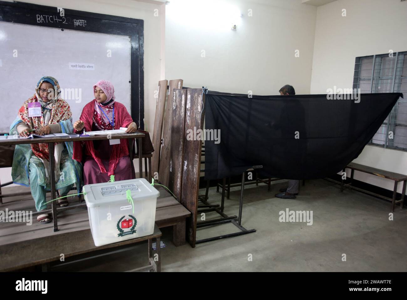 People casts her vote at a polling center during the 12th national ...