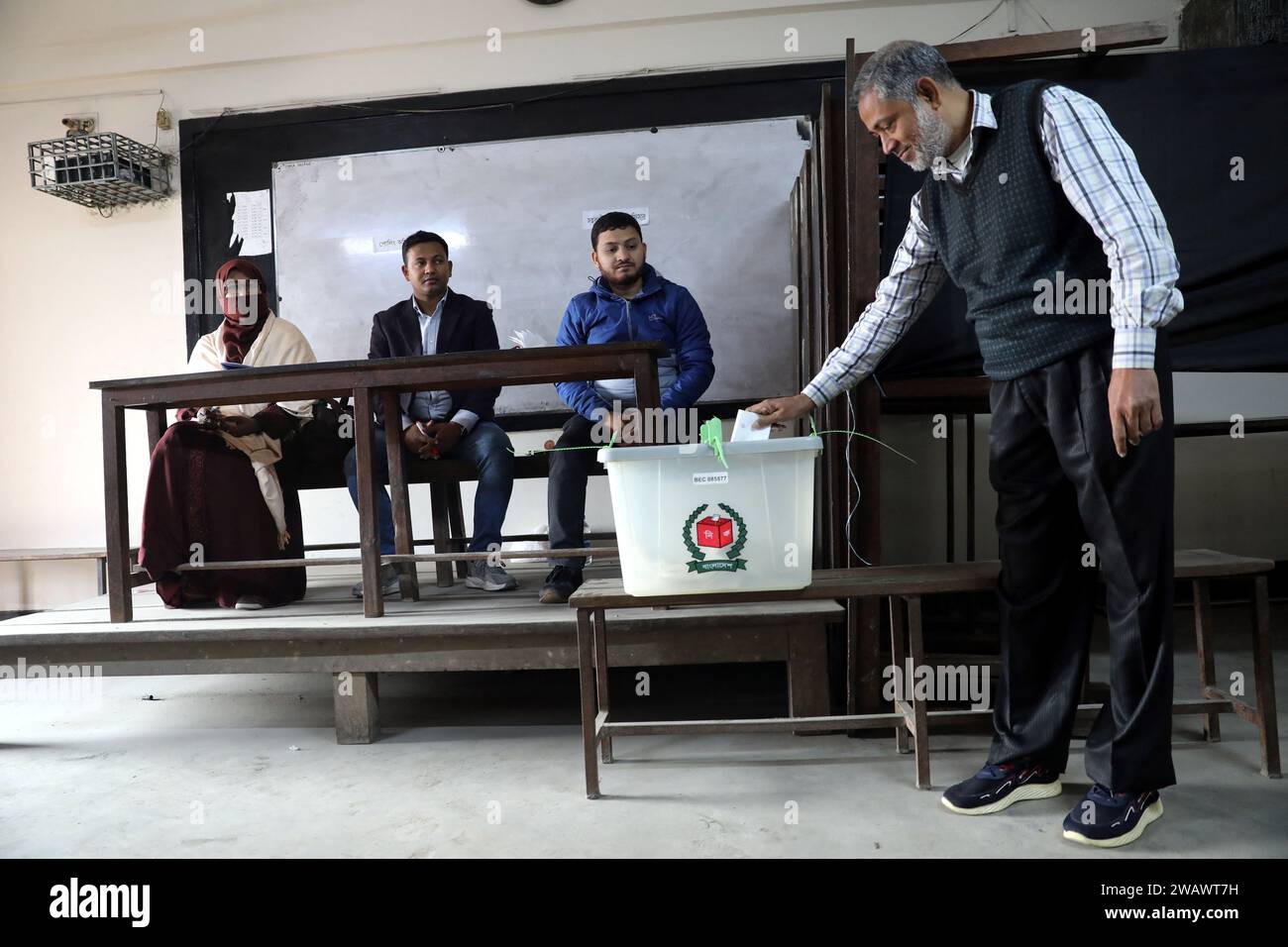 People casts her vote at a polling center during the 12th national ...
