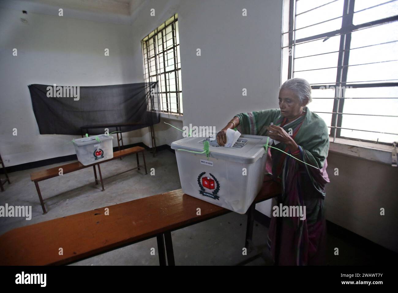 People casts her vote at a polling center during the 12th national ...