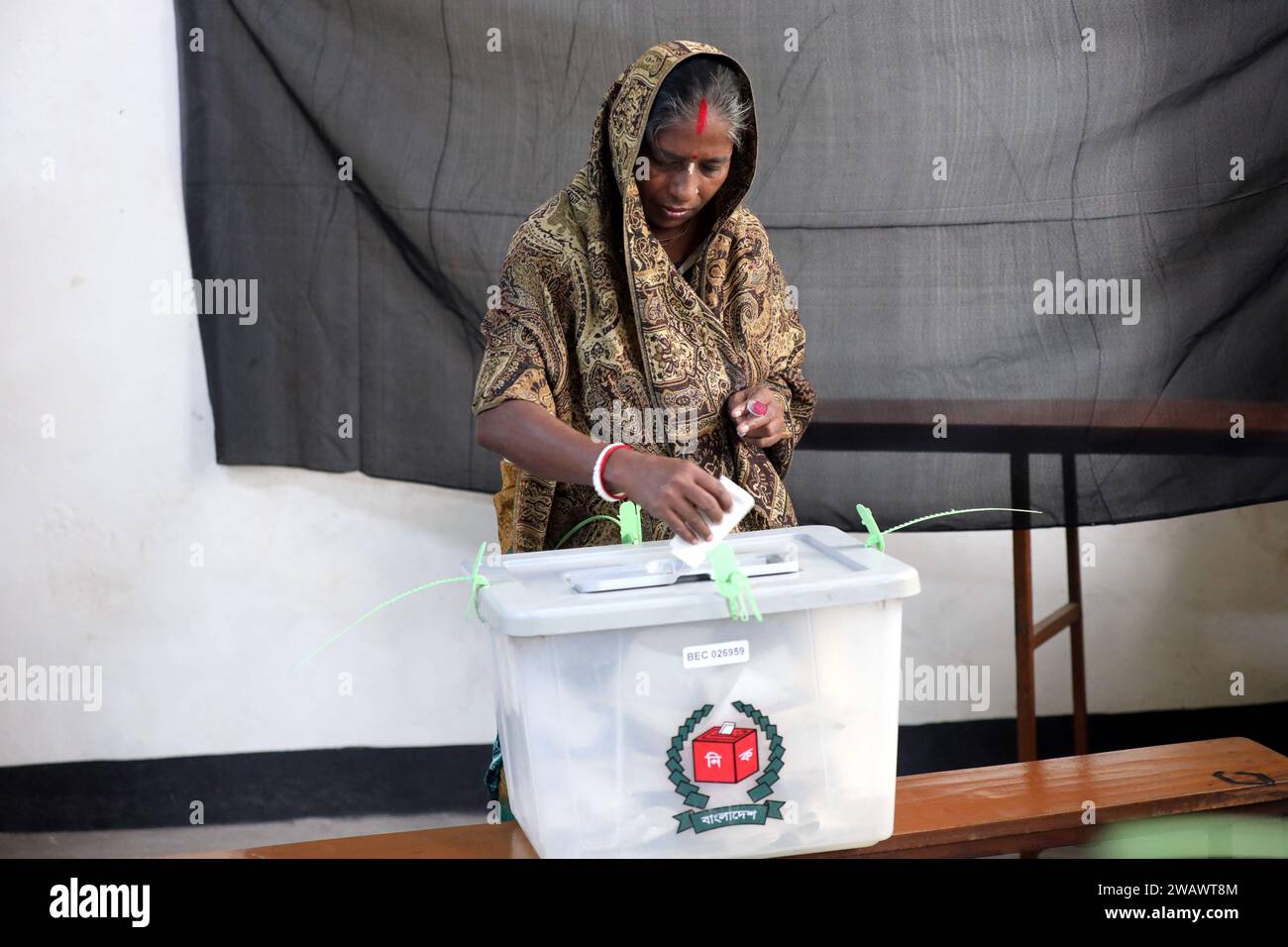 People casts her vote at a polling center during the 12th national ...
