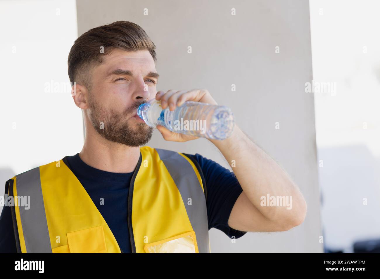 Healthy worker engineer team thirsty drinking clean water in hot temperature weather summer ...