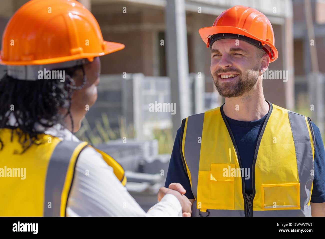 Happy construction engineer handshaking. Builder man enjoy working job ...