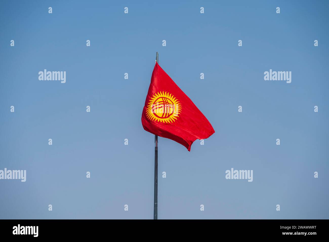 Kyrgyz flag in front of a blue sky, Bishkek, Kyrgyzstan Stock Photo - Alamy