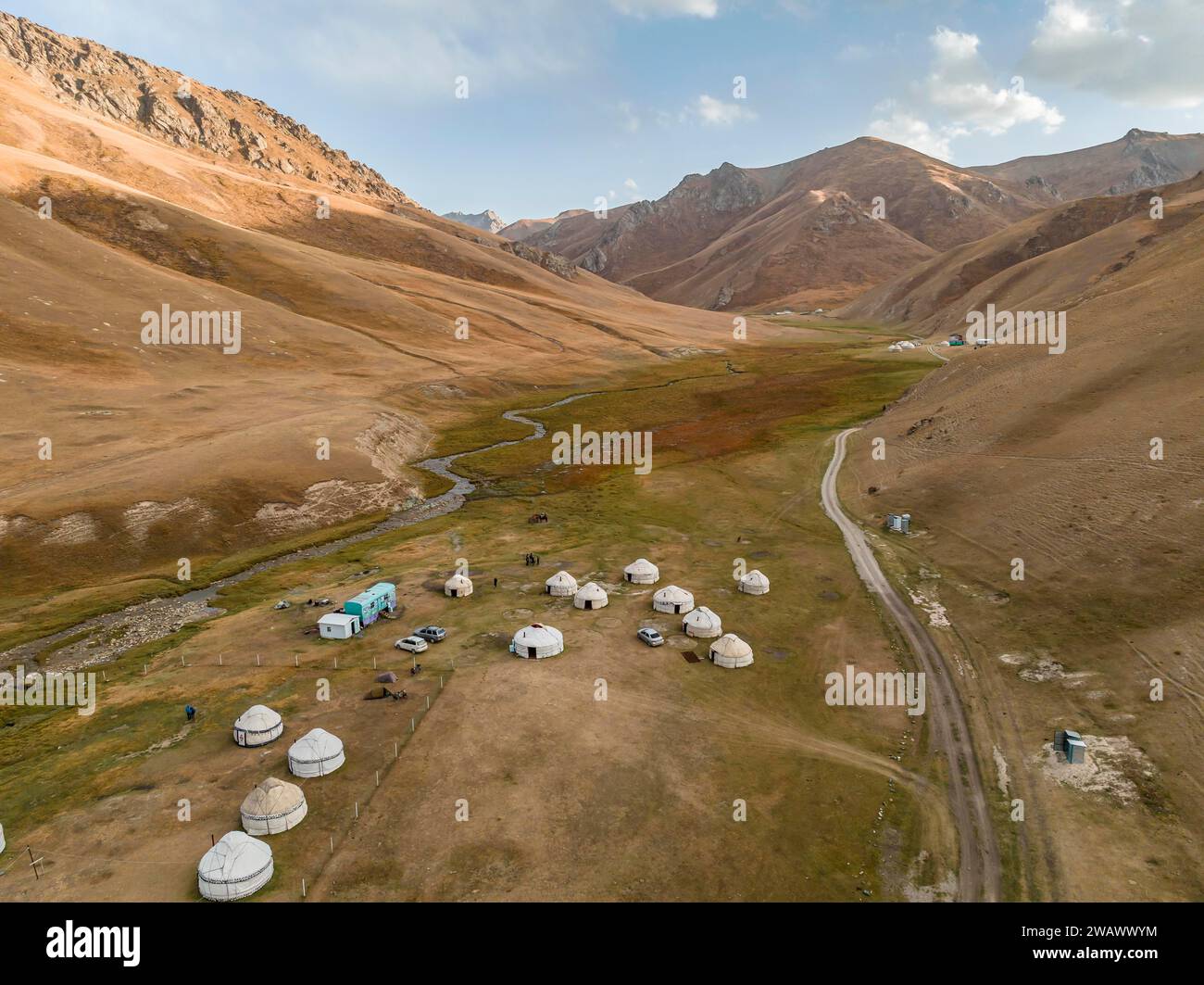 Aerial view, yurts in a mountain valley with a gravel road, Naryn ...
