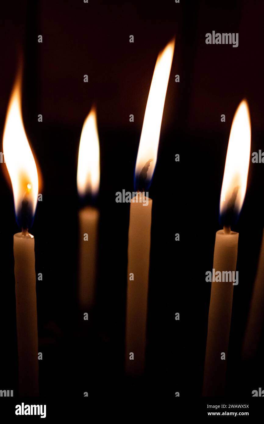 Candle lights in the darkness. Abstract candles background. Hope, fire ...