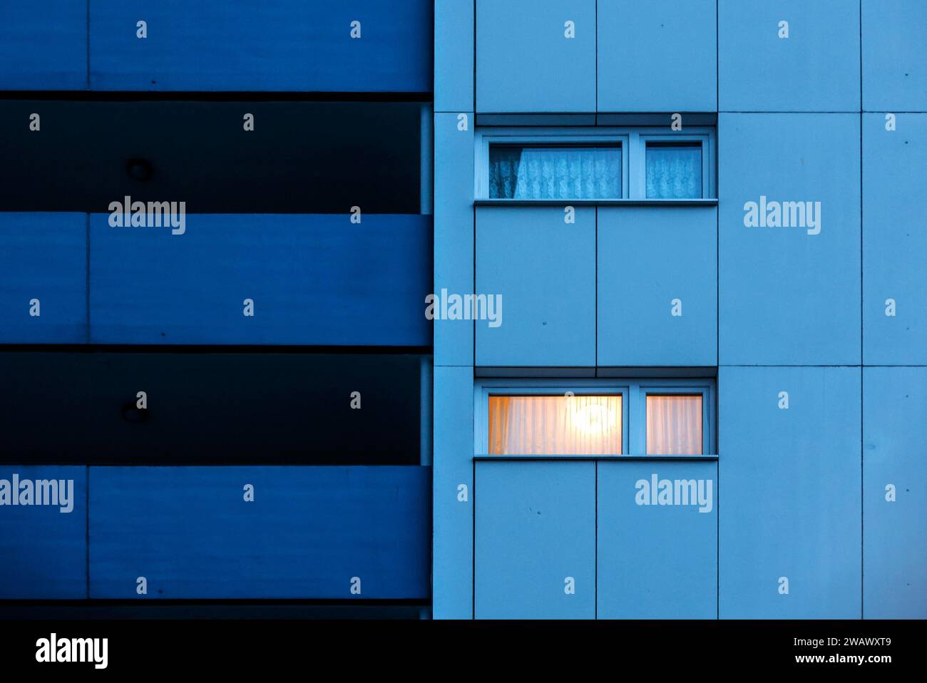 Illuminated room in a tower block in Gropiusstadt. The rise in rents in ...