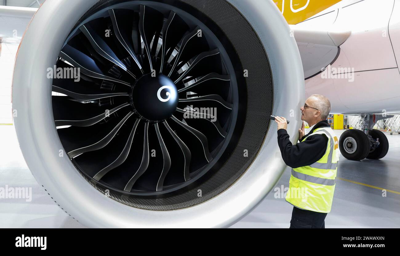 Olaf Gross, Licence Engineer at easyJet, checks the engine of an Airbus ...