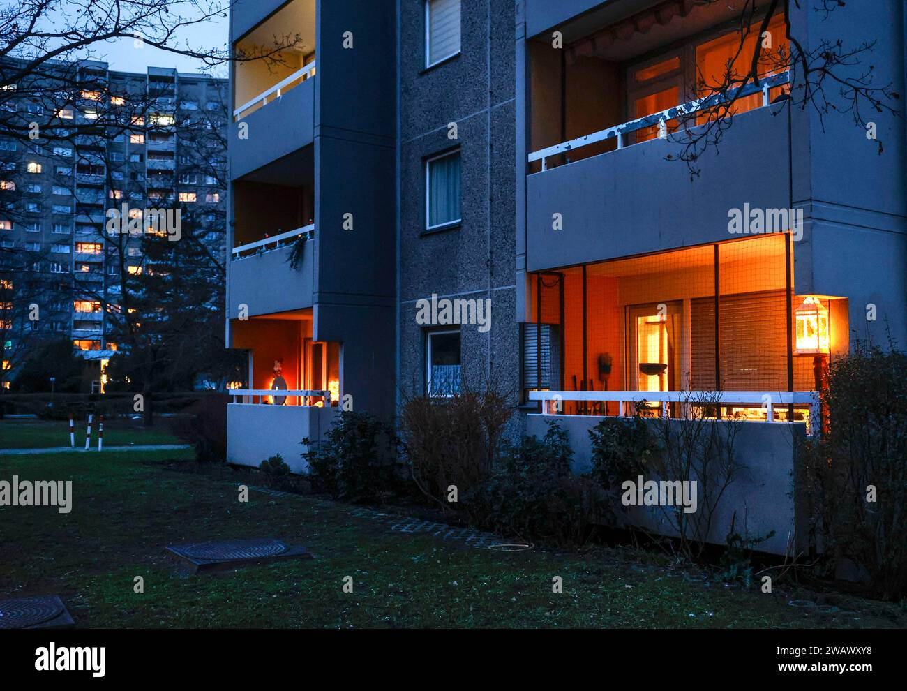 Illuminated balconies on a tower block in Gropiusstadt. The rise in ...