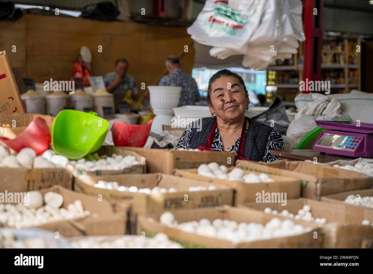 Traditional woman selling food, market stall at Osh Bazaar, Bishkek ...