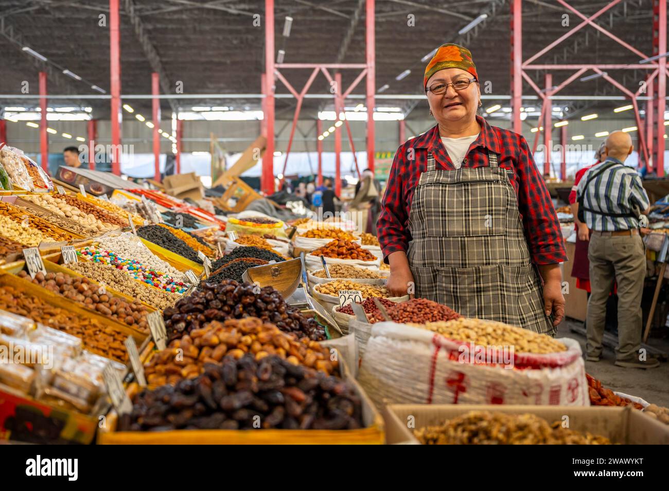 Traditional woman selling food, market stall at Osh Bazaar, Bishkek ...