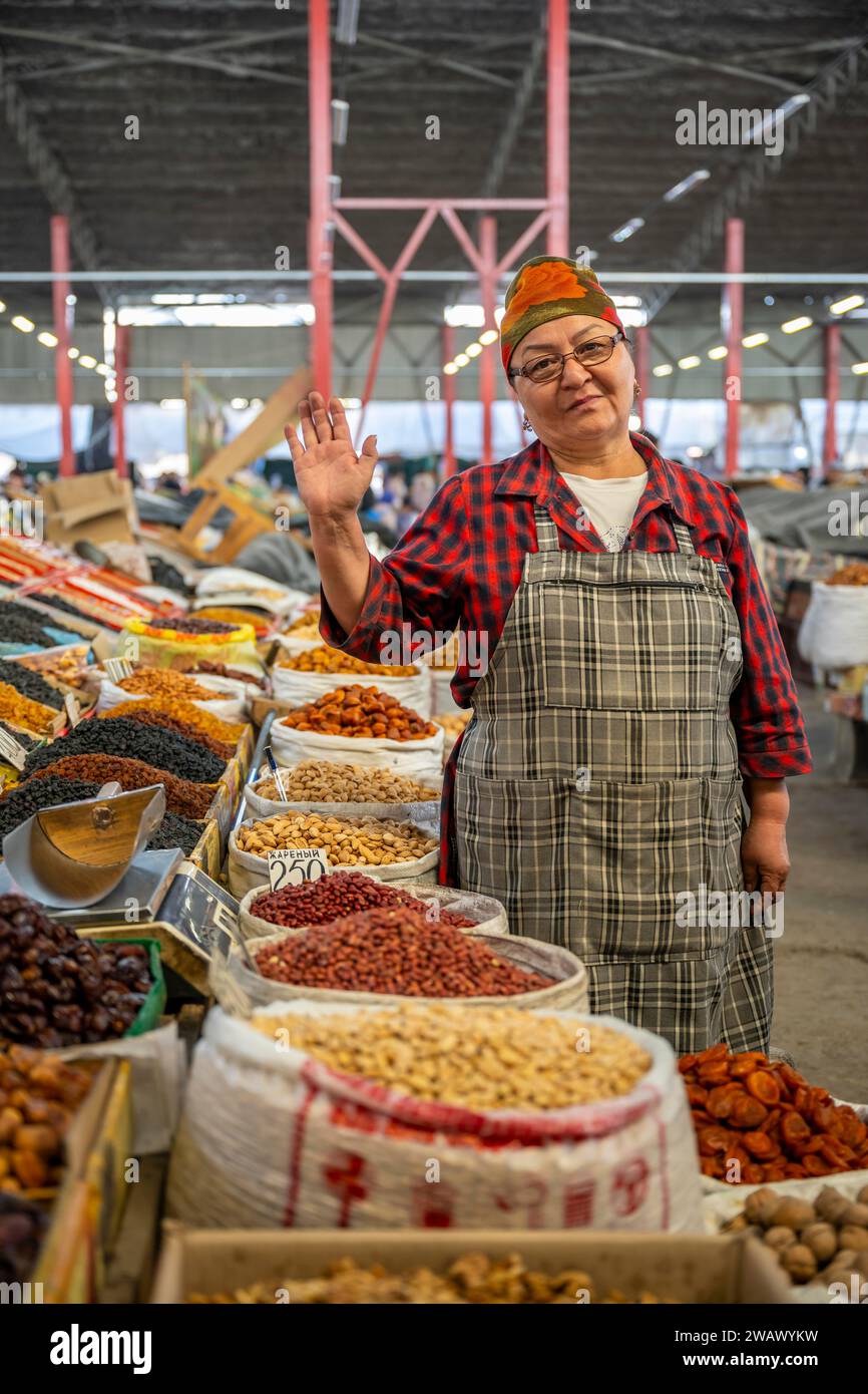 Traditional woman selling food, market stall at Osh Bazaar, Bishkek ...