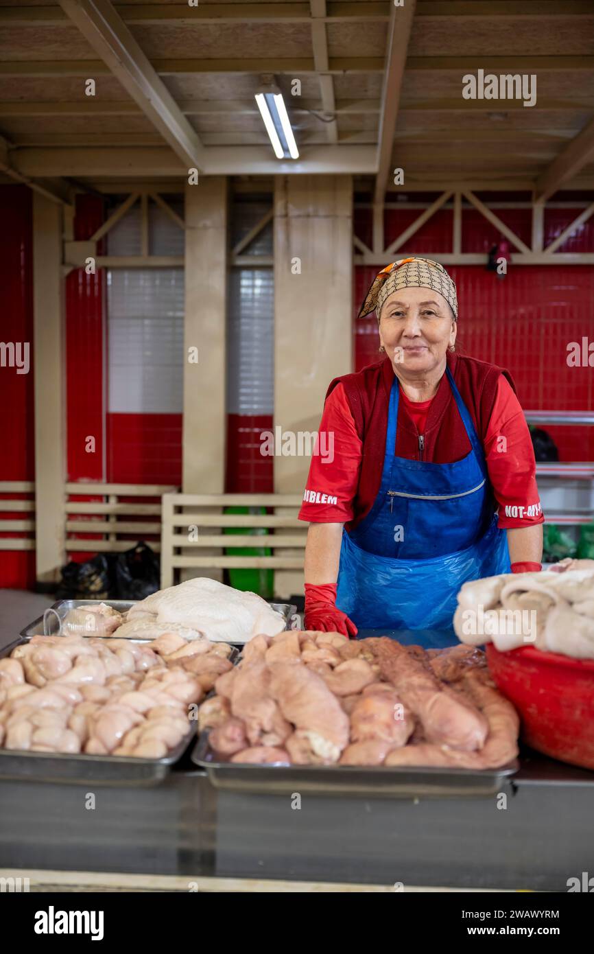 Woman selling meat and entrails, butcher's shop with fresh meat, market ...