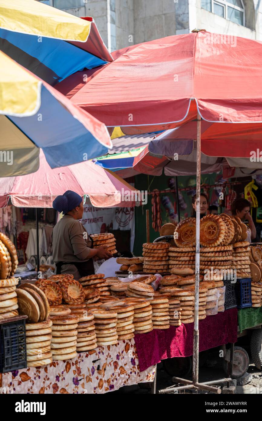 Woman selling bread, stall, Osh bazaar, Bishkek, Kyrgyzstan Stock Photo ...