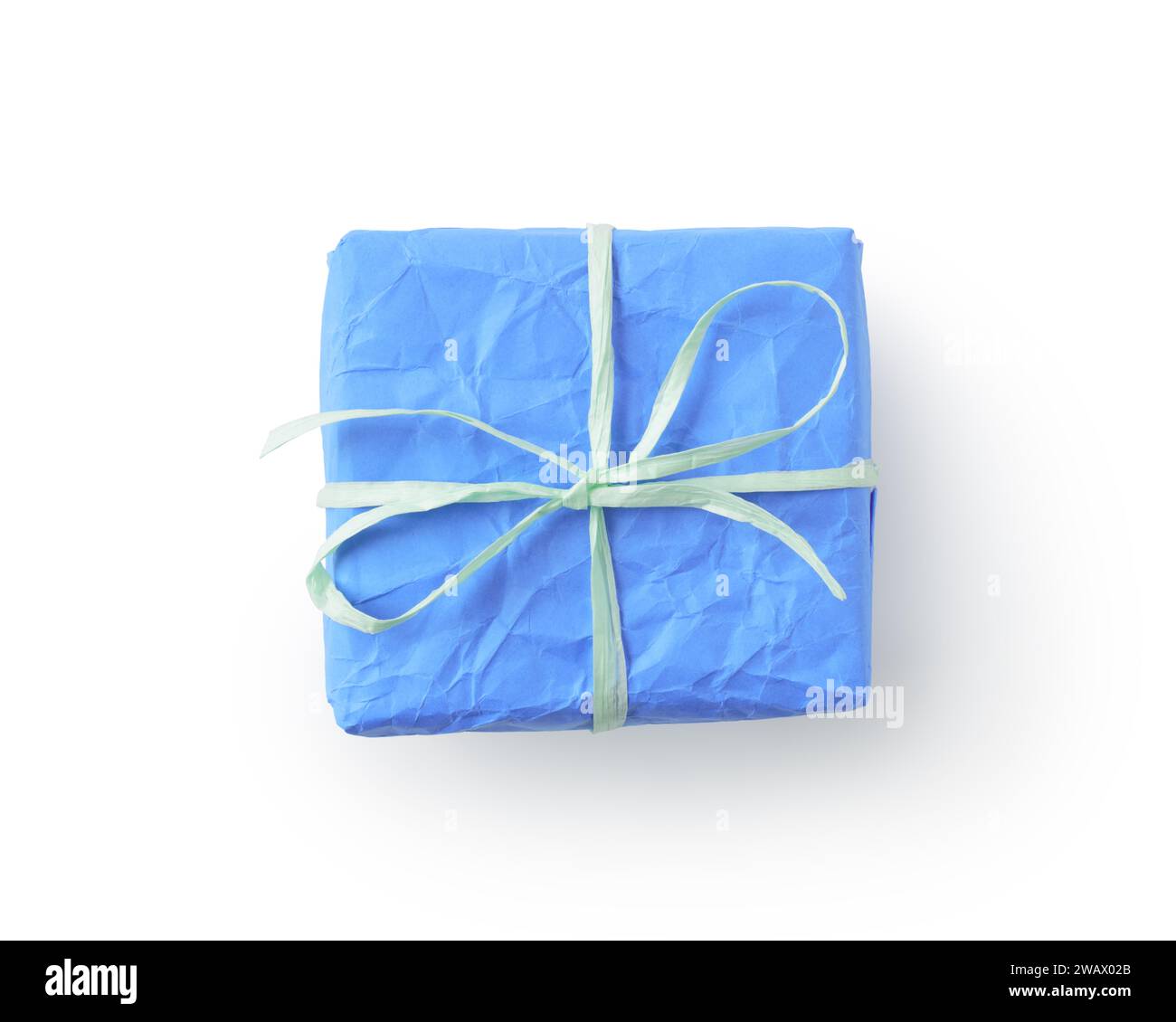 Top view of crumpled paper blue color present box with recycled paper ...