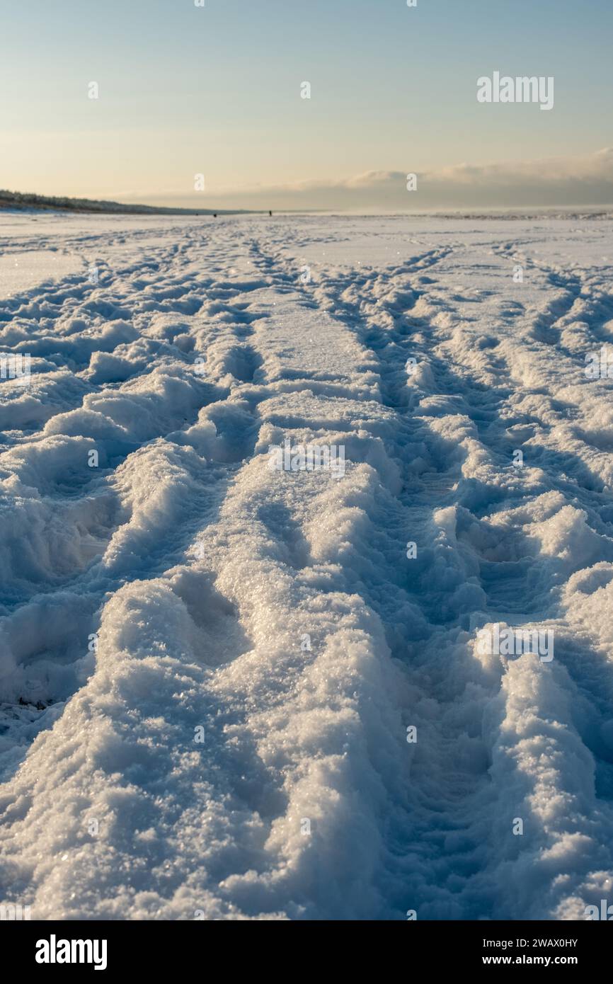 The path less traveled, adorned in snow, basks in the serenity of ...