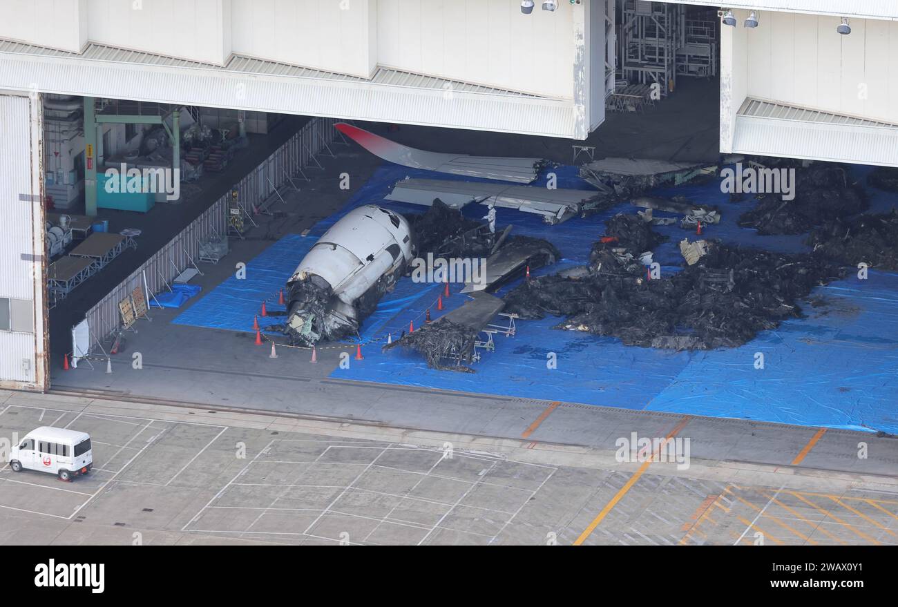 Debris of the Japan Airlines Flight 516, which was burnt after it ...
