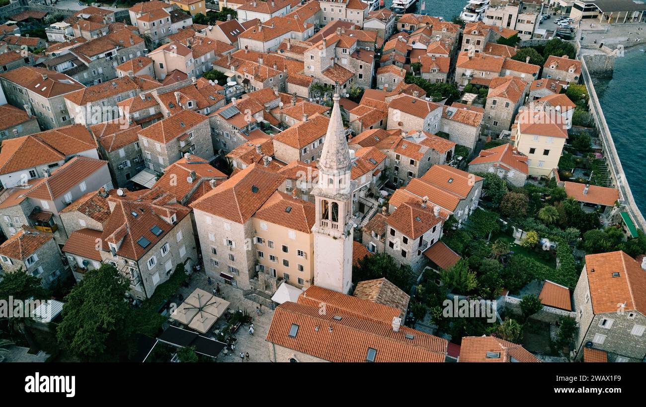 High bell tower of the Church of St. Ivan among the ancient houses of ...