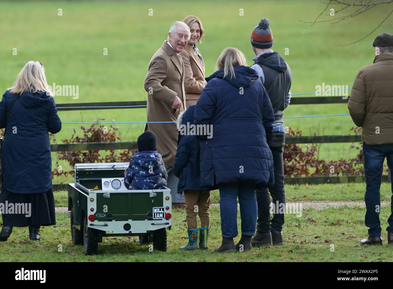 King Charles III talks to Simon and Georgina Ward and their sons ...