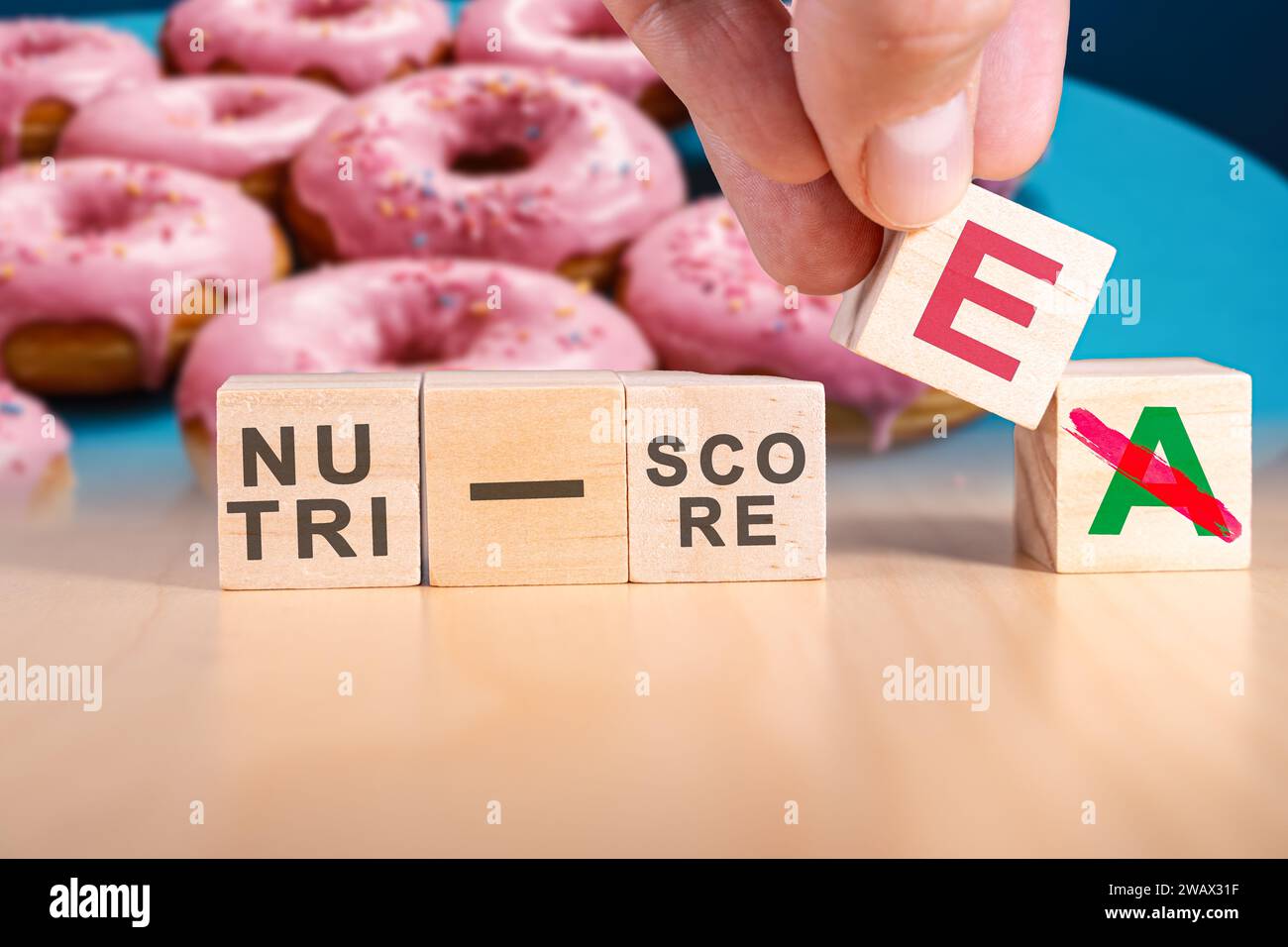 Hand changing the expression nutri-score A to nutri-score E Stock Photo ...