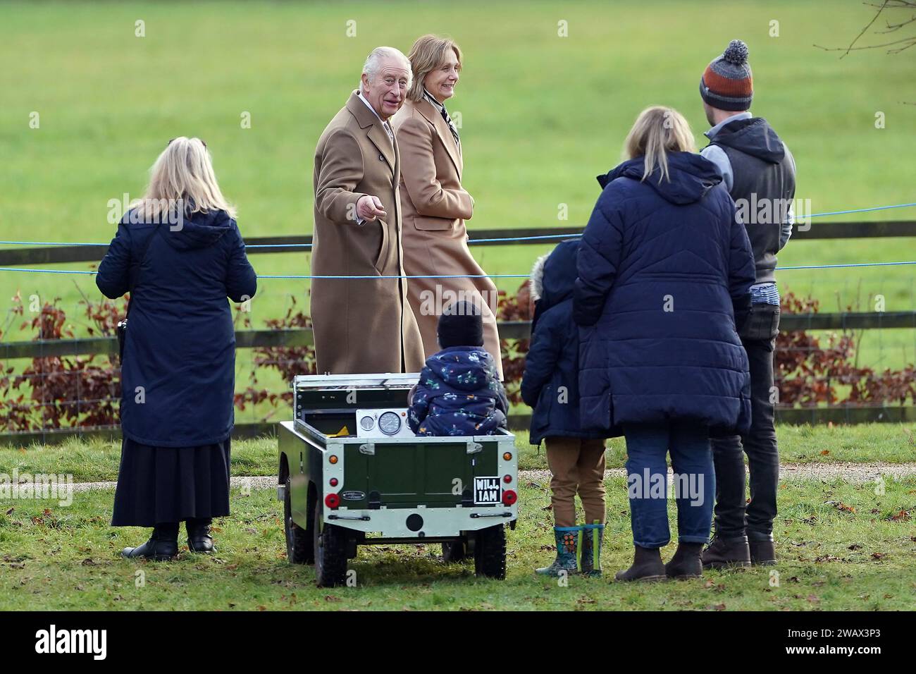 King Charles III talks to Simon and Georgina Ward and their sons ...