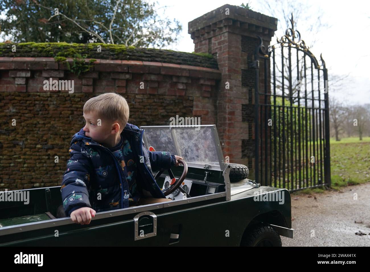 Oliver Ward drives his toy car to see King Charles III attending a ...